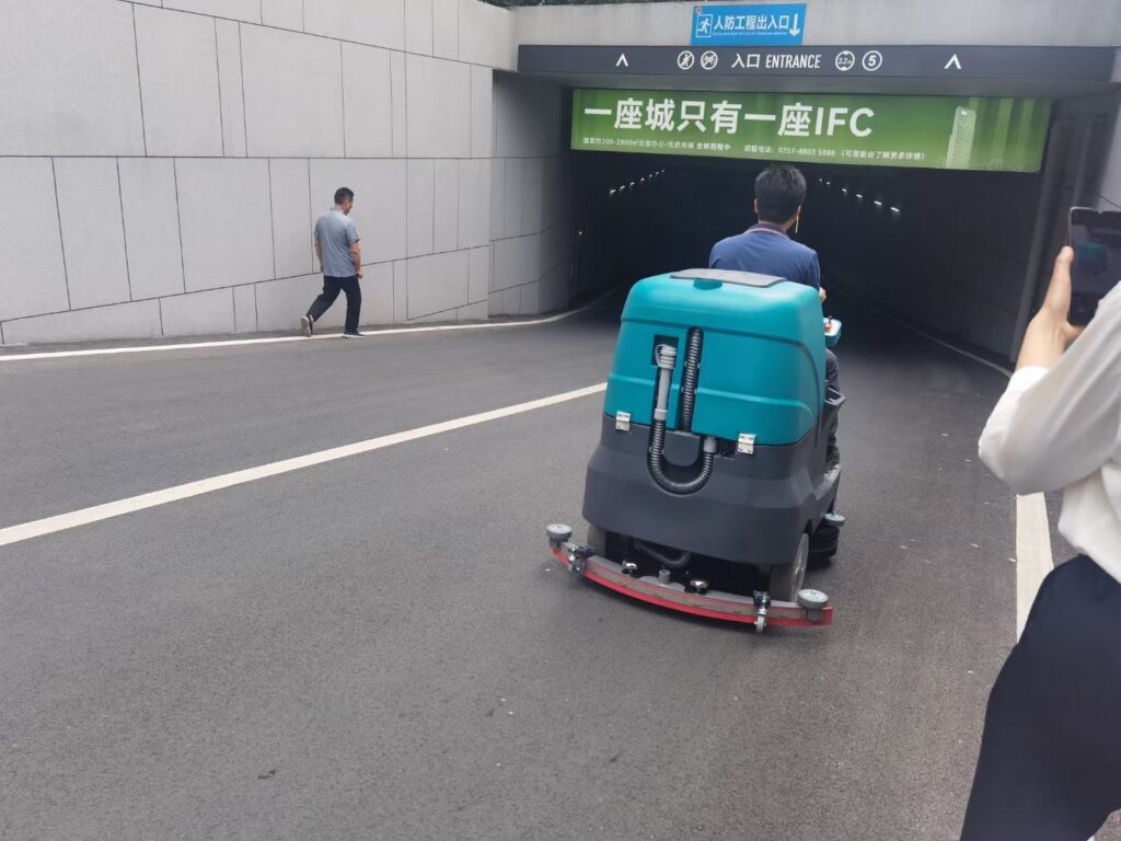 Rider Scrubber challenges 20% slope test ramp of large garage cleaning ...